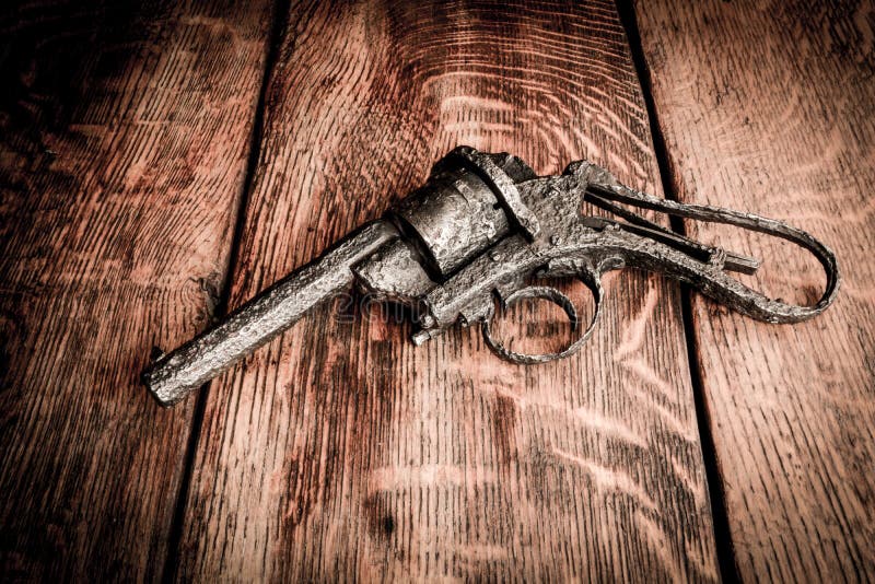 Old gun on wooden table stock photo. Image of weapon - 50706950