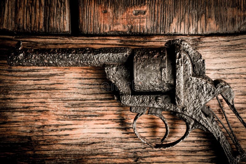 Old gun on wooden table stock photo. Image of military - 50709316