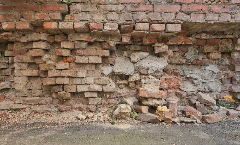 Old Half Destroyed Red Brick Wall with a Pile of Rubble Stock Photo ...