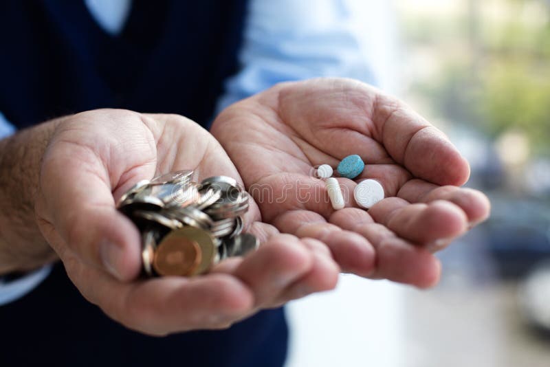 Old Hand Holding Pills and Coins Stock Photo - Image of hand, drug ...