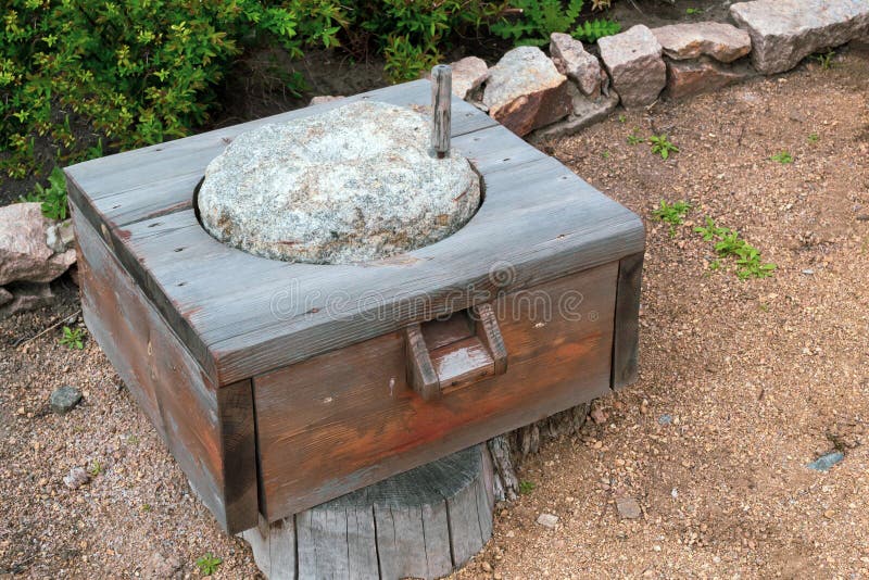 Old hand mill for grain stock photo. Image of heavy - 182750176