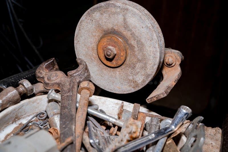 Old Hand Operated Whetstone in a Workshop with Old Tools and Rusted ...