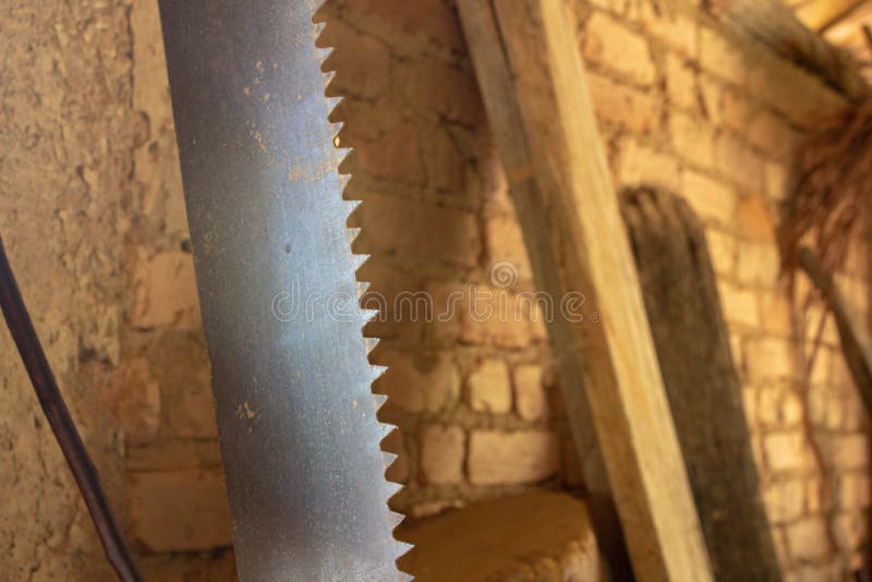 Old Hand Saw Resting on a Brick Wall of a Farm Stock Photo - Image of ...