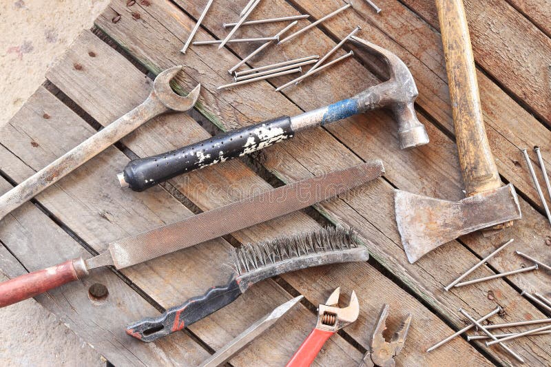 Old Hand Tool on a Wooden Surface. Composition from an Old Rusty Tool ...