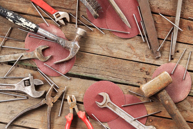Old Hand Tool on a Wooden Surface. Composition from an Old Rusty Tool ...