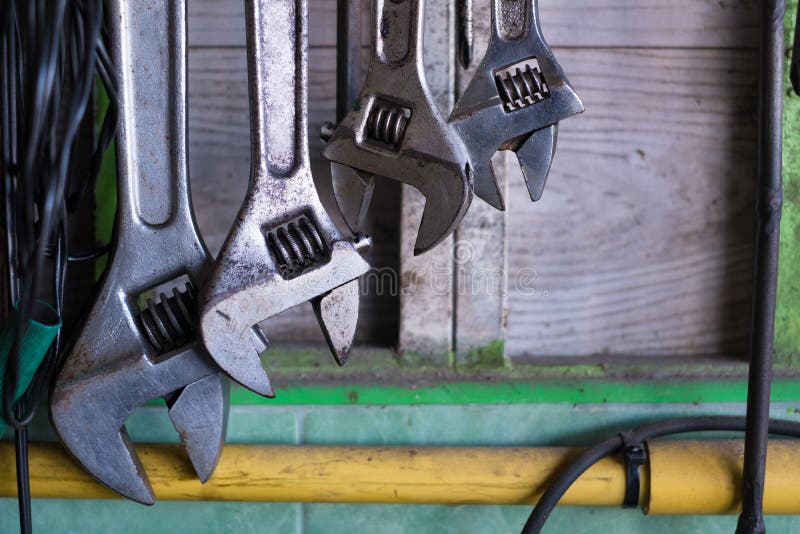 Old Hand Tools Hanging on Wall in Workshop or Auto Service Garage, Many ...