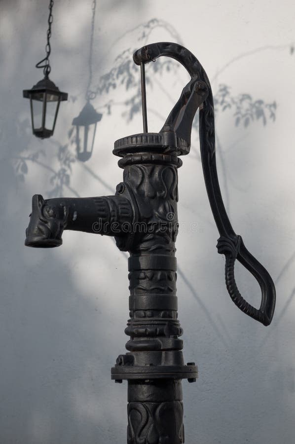 Old Hand Water Pump and a Lantern Stock Image - Image of lantern ...