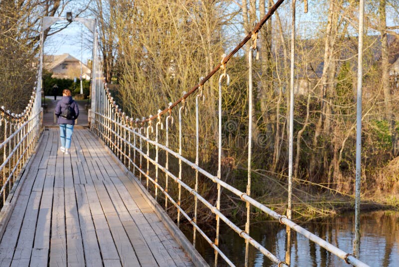 The Very Old Hanging Footbridge Across a Small River in Estonia Stock ...