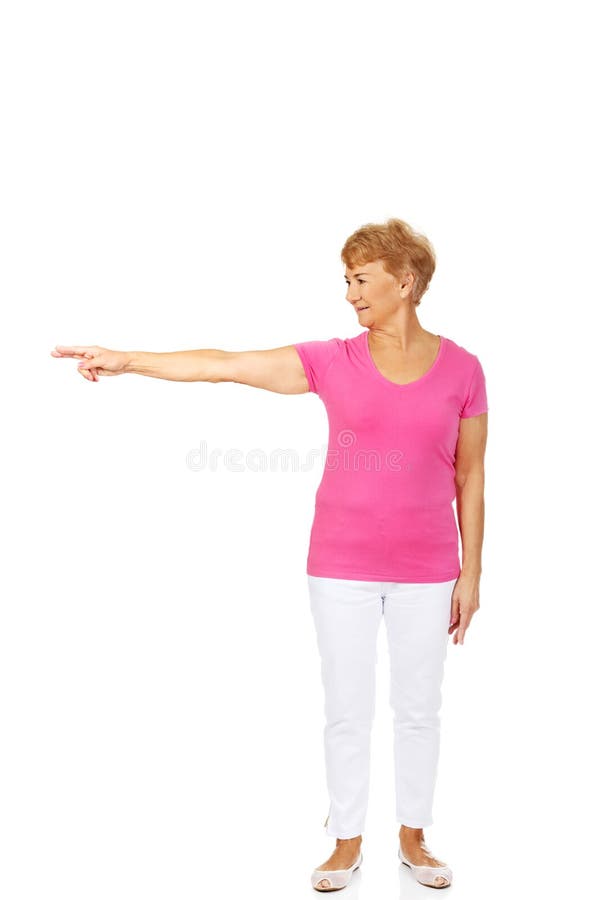 An Old Happy Lady Pointing for Something Stock Photo - Image of ...
