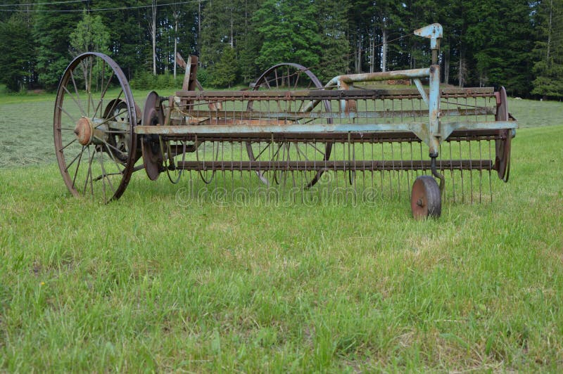 Old Hay Tedder Still in Use Stock Image - Image of used, rusty: 150124763