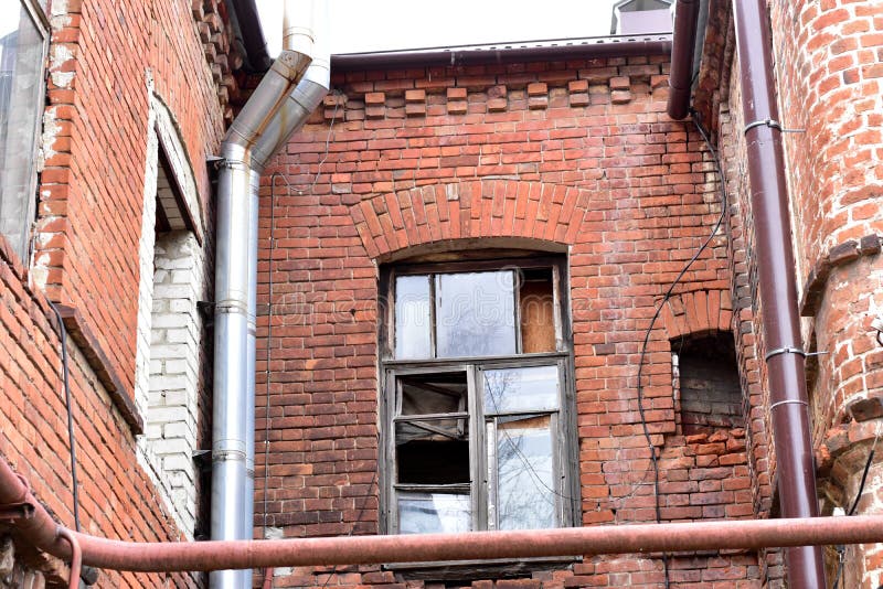 An Old High-rise Building Built of Red Bricks. Stock Photo - Image of ...