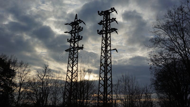 Old high voltage pylons editorial photo. Image of sunset - 85323256