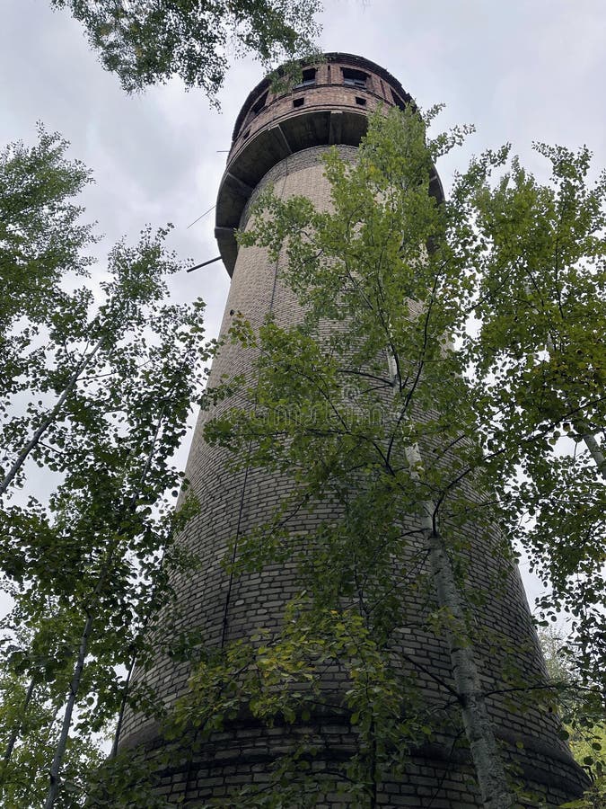 Old High Water Tower Surrounded by Trees. Brick Tower in Countryside ...