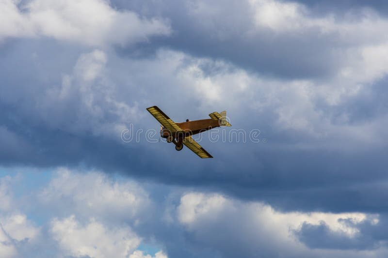 Old Historic Biplane Fly on Cloudy Sky from Side Stock Photo - Image of ...