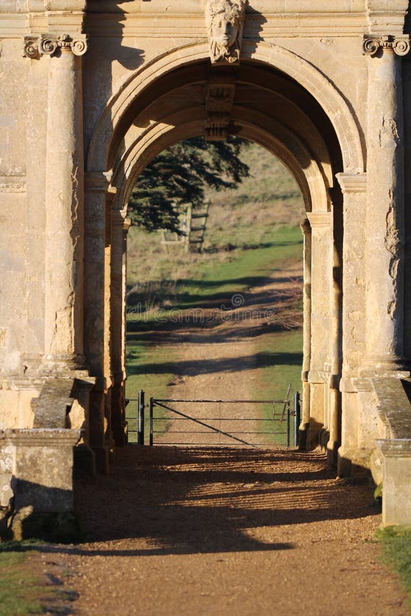 Old Historic Stone Arch with Columns Under Sunlight Stock Image - Image ...