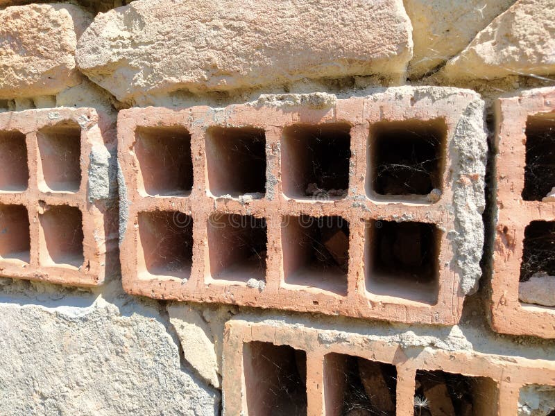 Old Hollow Brick Wall Background. Uneven Brick Wall on the Side. Red ...