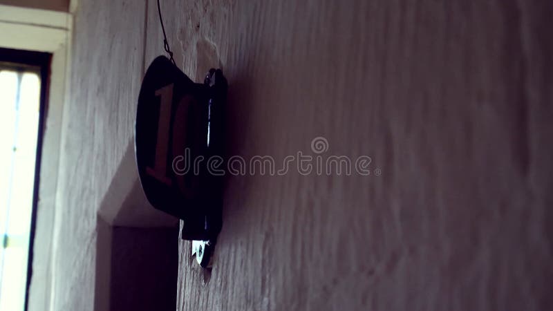 Old House Number Sign 10 Detaching Itself from the Wall Stock Video ...