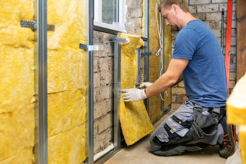 Construction Worker Insulating Brick Wall with Glass Wool Stock Image ...