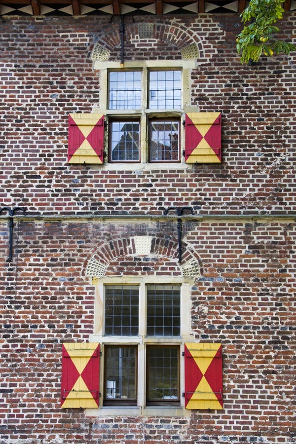 Old House with Red and Yellow Shutters Stock Image - Image of rustic ...