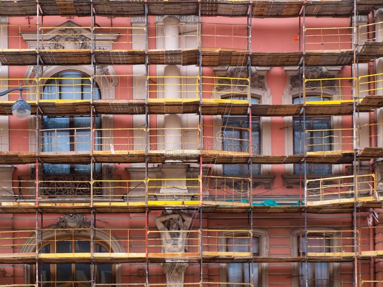 Old house in scaffolding stock photo. Image of construction - 32031614