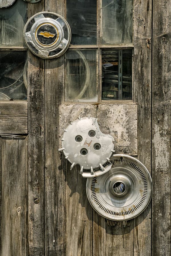 Old Hubcaps in a Dirty Window Editorial Photography - Image of ...