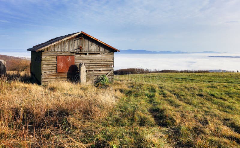Old Hut Over Clouds in Pasture Mountain Landscape Stock Image - Image ...