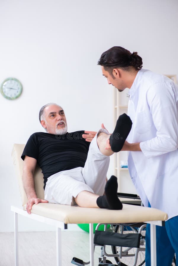 Old Injured Man Visiting Young Doctor Stock Photo - Image of injured ...