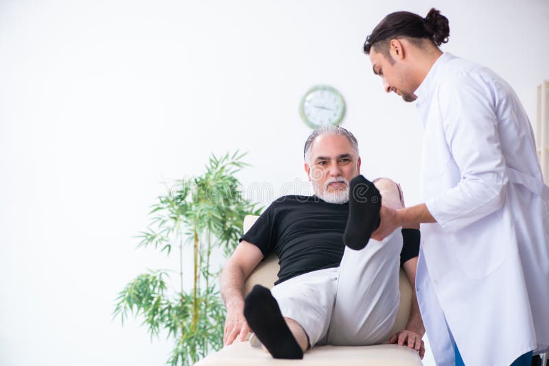 Old Injured Man Visiting Young Doctor Stock Photo - Image of fracture ...