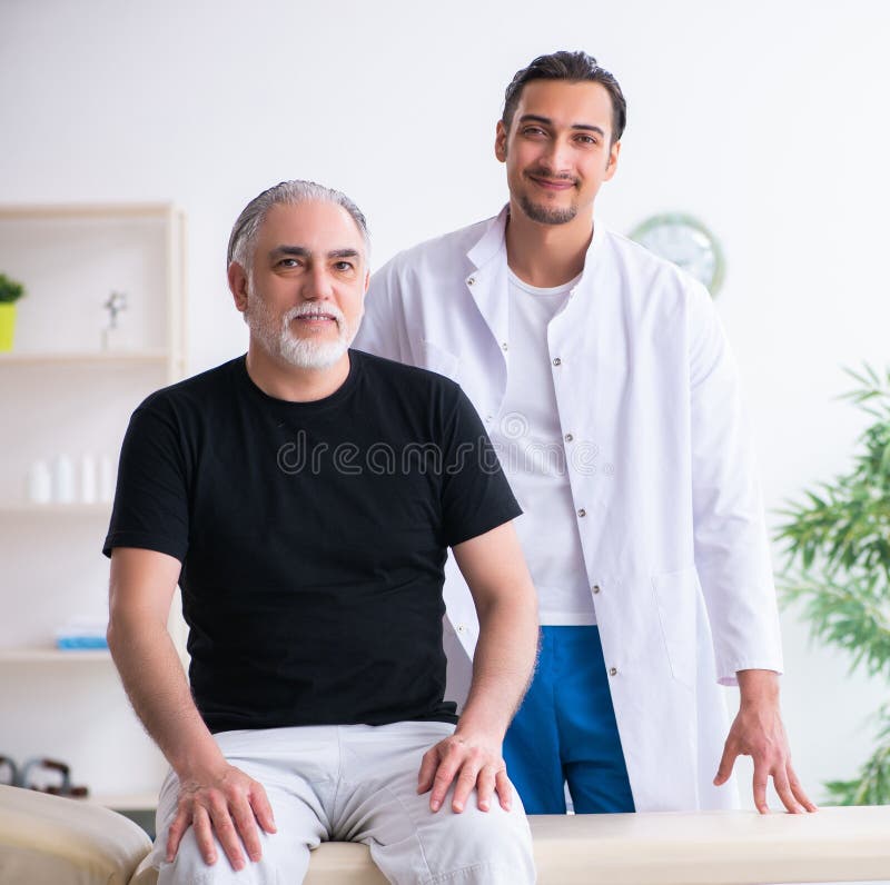 Old Injured Man Visiting Young Doctor Stock Image - Image of mature ...