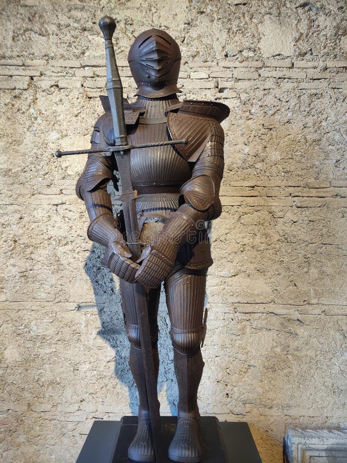 Old Iron Armor of Medieval Knight with a Big Sword Stock Photo - Image ...