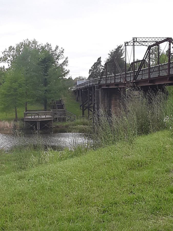 Old Iron Bridge of Big Bend with Dock by Water Stock Image - Image of ...