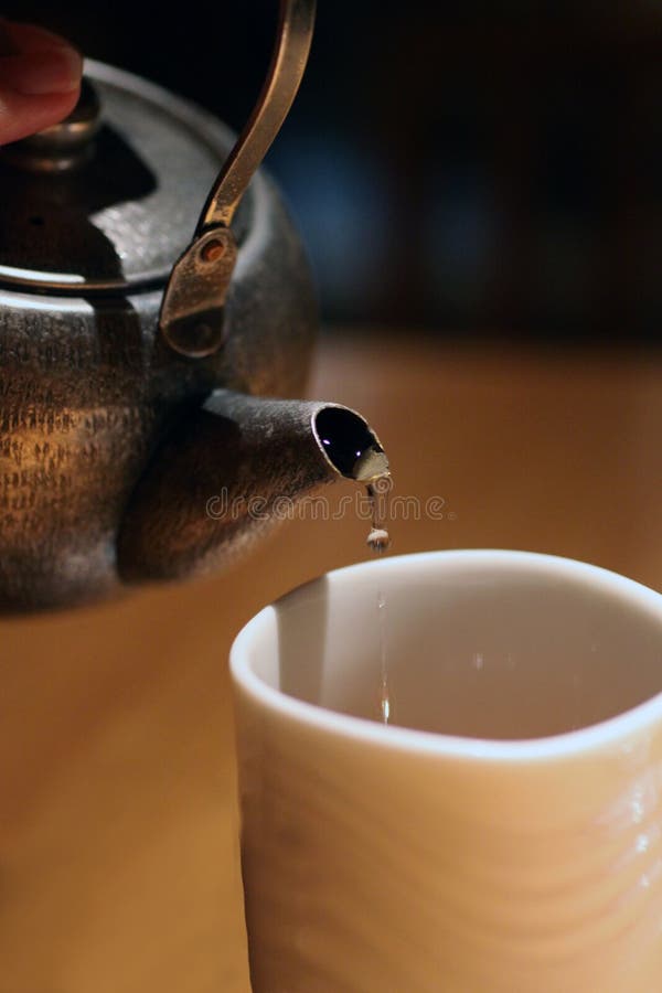 Old Iron Cattle Ready To Pour Tea into a Cup Stock Photo - Image of ...
