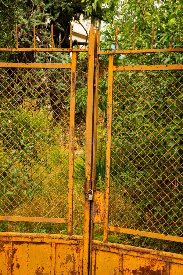 Old Iron Gate in Front of Neglected Garden Stock Photo - Image of ...