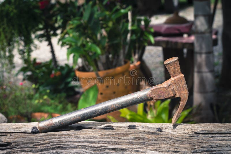 Old iron hammer on timber stock image. Image of lumber - 58835637