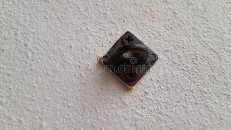 Old Iron Ring in a Metal Loop on White Wall Stock Image - Image of ...