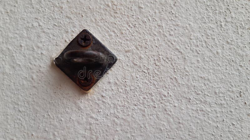 Old Iron Ring in a Metal Loop on White Wall Stock Image - Image of ...