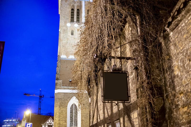 The Old Iron Sign on the Building in the Evening Stock Image - Image of ...