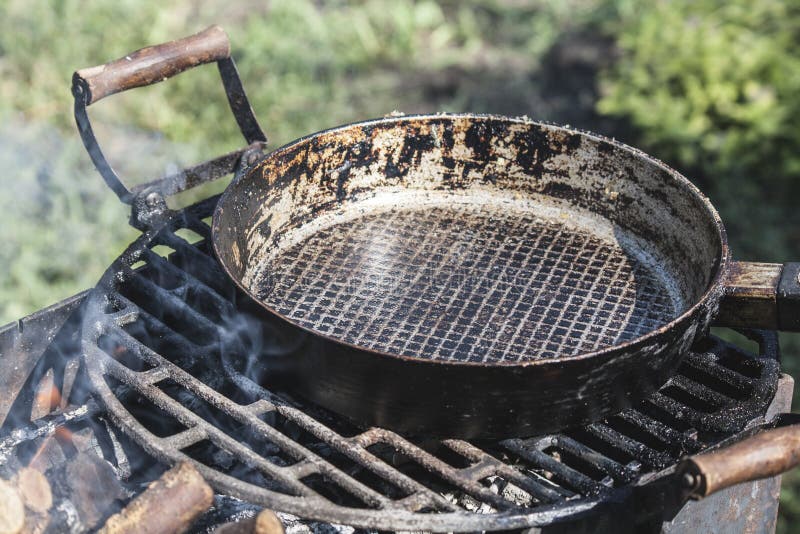 Old Iron Skillet on the Fire. Brazier. Field Cooking Stock Photo ...