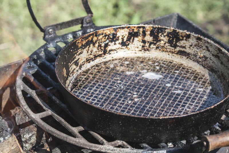 Old Iron Skillet on the Fire. Brazier. Field Cooking Stock Image ...