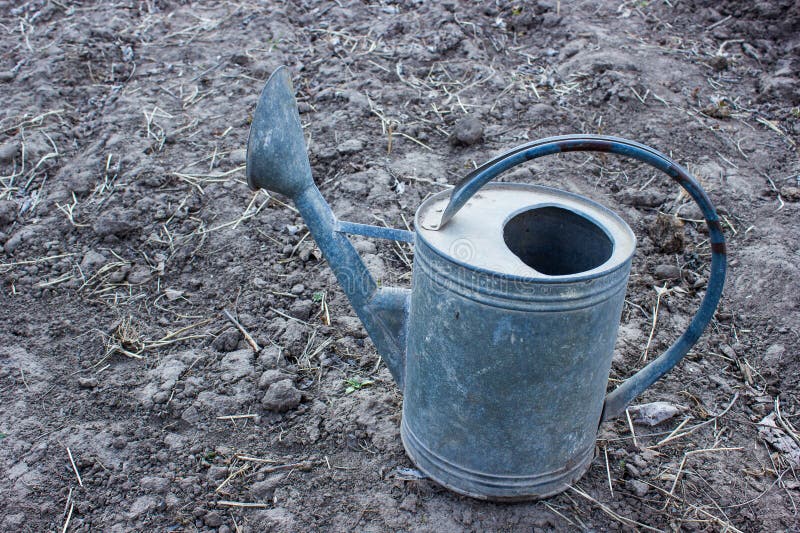 Old Iron Watering Can is on Dry Ground Stock Image - Image of ...