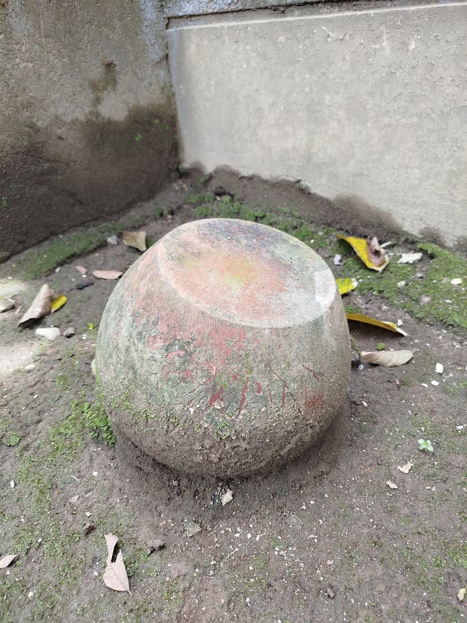 An Old Jar Embedded in the Ground until it is Covered in Moss Stock ...