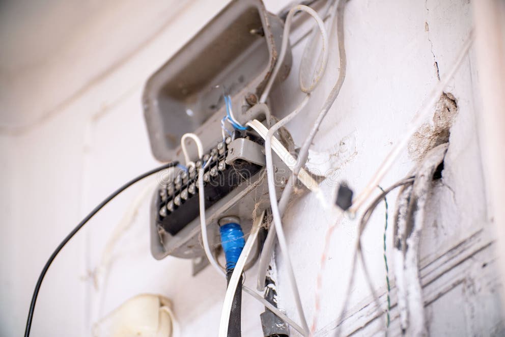An Old Junction Box with Wires on a Light Wall Stock Image - Image of ...