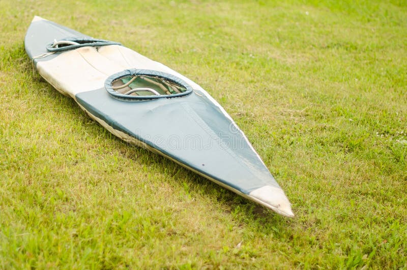 An Old Kayak is Placed in the Green Grass Stock Image - Image of ...