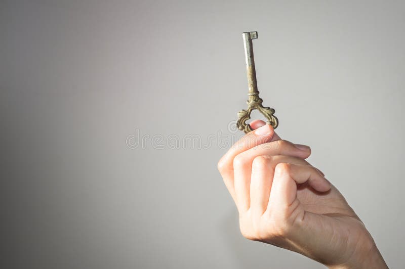 Old key in girl hand. stock image. Image of hand, golden - 115967725