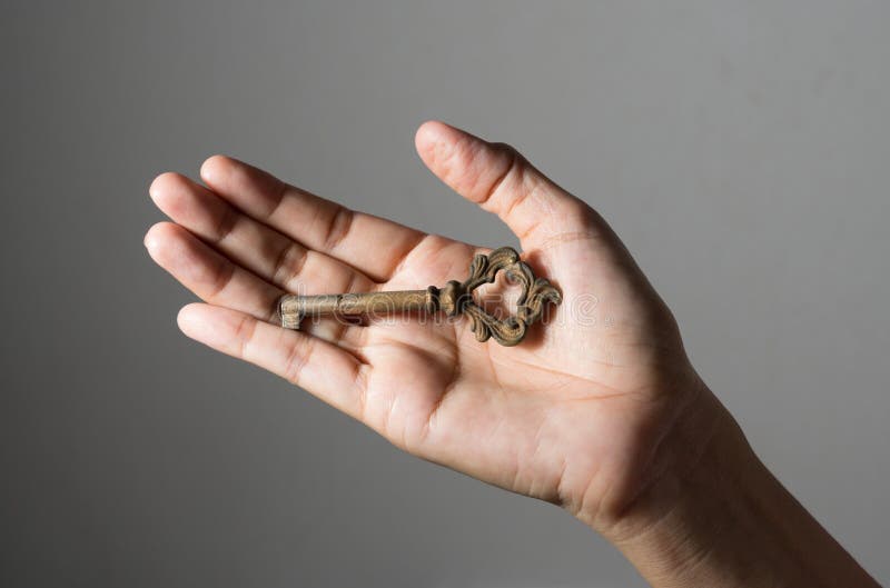 Old key in girl hand. stock image. Image of security - 116063431