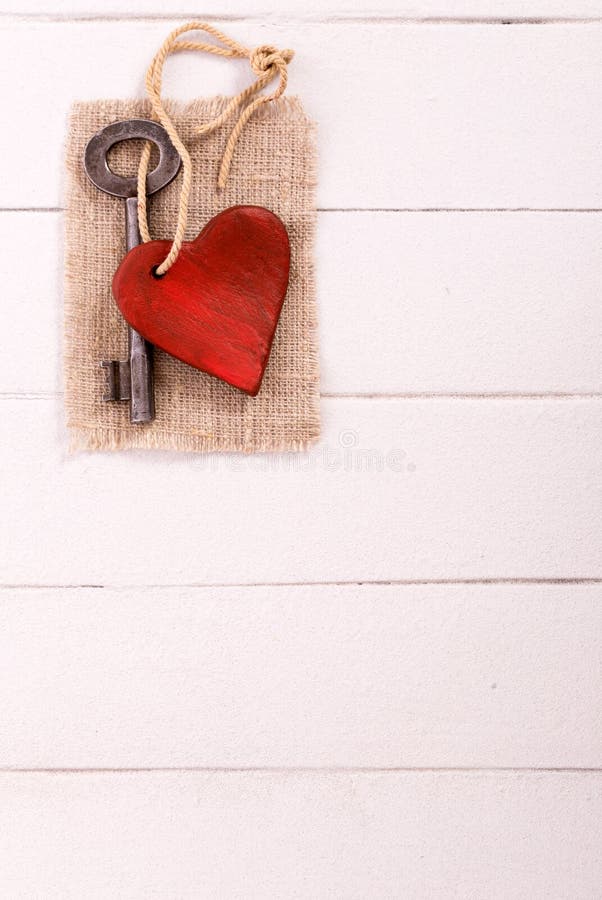 Old Key with a Heart on White Wood Stock Photo - Image of eisenring ...
