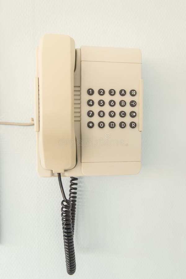 Old Keypad Button Phone Hangs on the Wall Stock Image - Image of phone ...