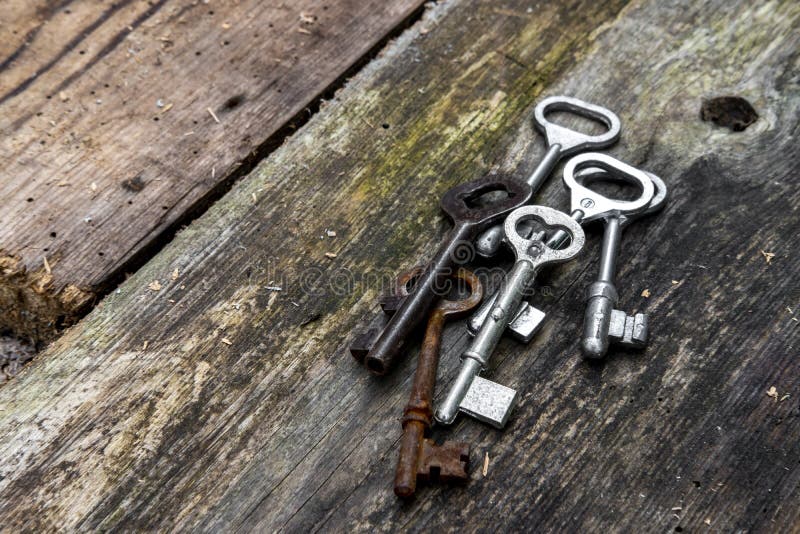 Old Keys of Different Sizes on Rustic Weathered Wood Planks Stock Image ...