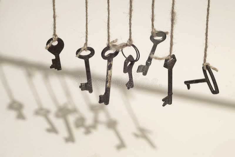 Old Keys Hanged on the Ropes with Drop Shadow on the Wall Stock Image ...