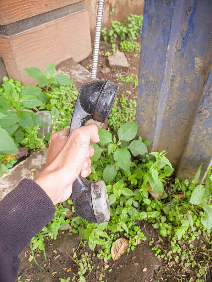 An Old Kind of Telephone Handle that is Isolated with a Man S Hand ...